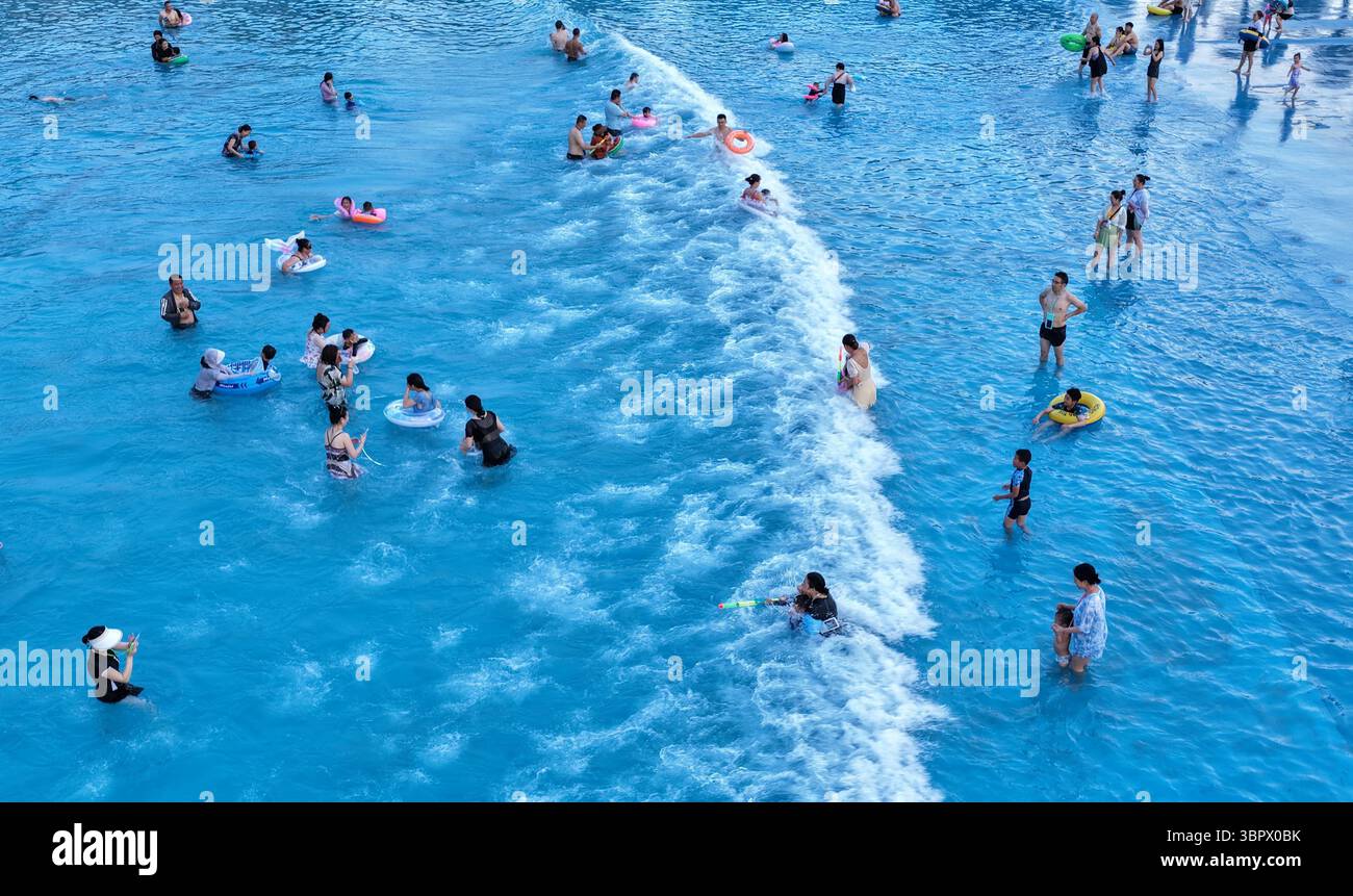 Aerial photo shows people playing at a water park in Yangzhou City ...