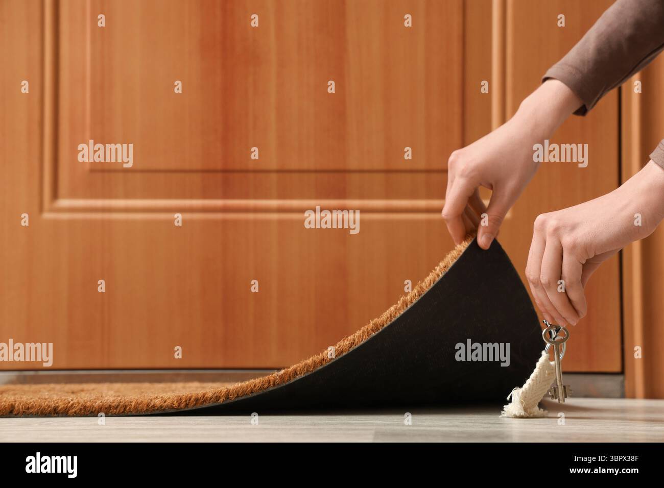 Woman putting key from hi-res stock photography and images - Alamy