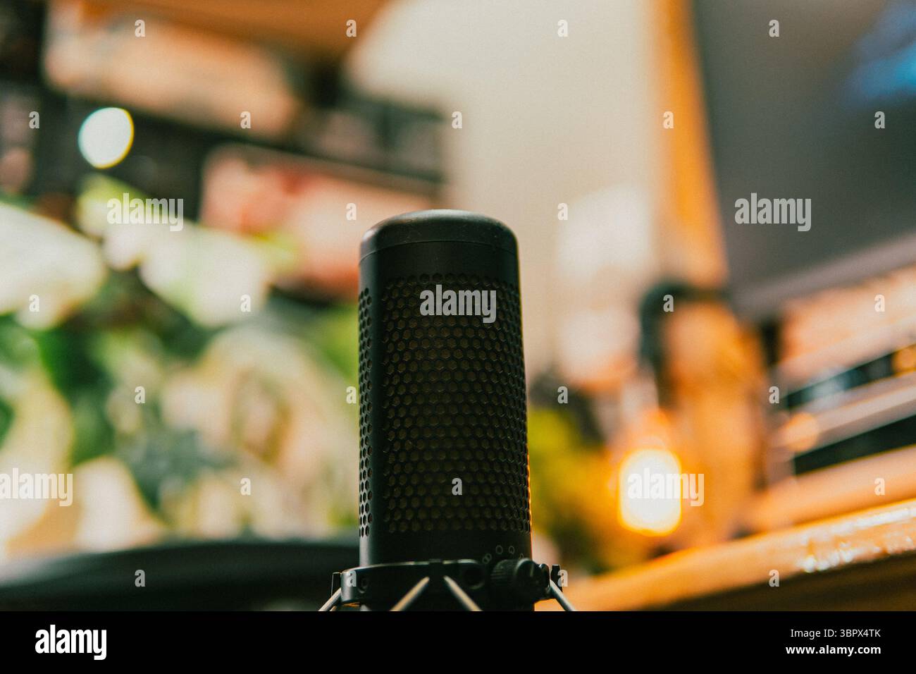 Modern cinematic desk setup with triple monitor, gaming chair, ambient light, and cozy ...