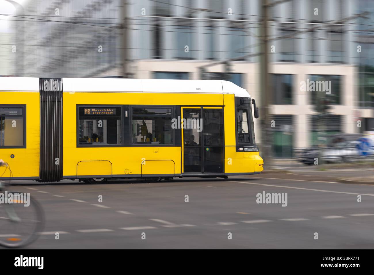 Tram at intersection. Yellow urban transport. Motion blur effect Stock ...