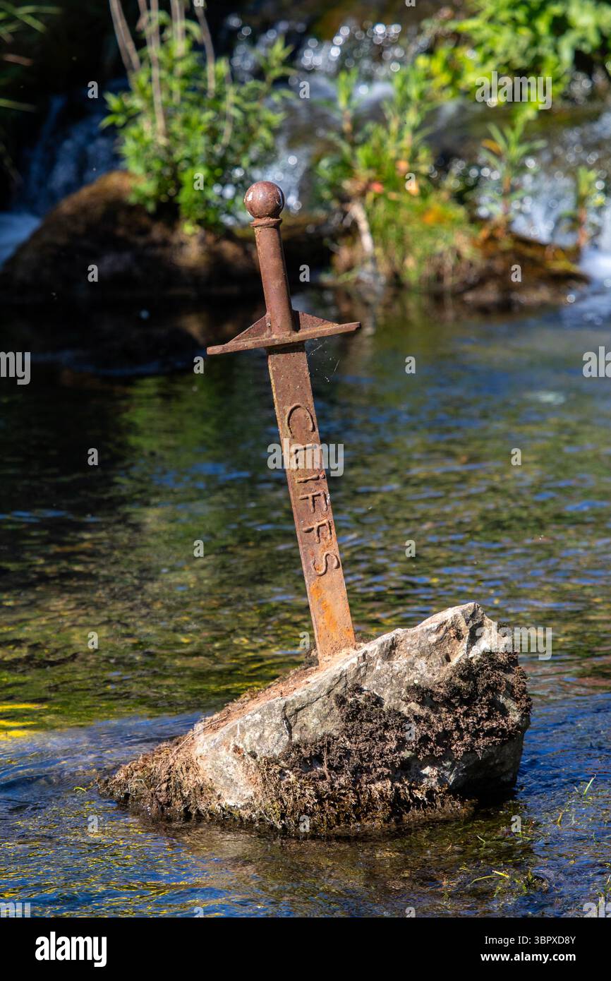 View of the Sword in the Stone sculpture, in the Cheddar Yeo river ...