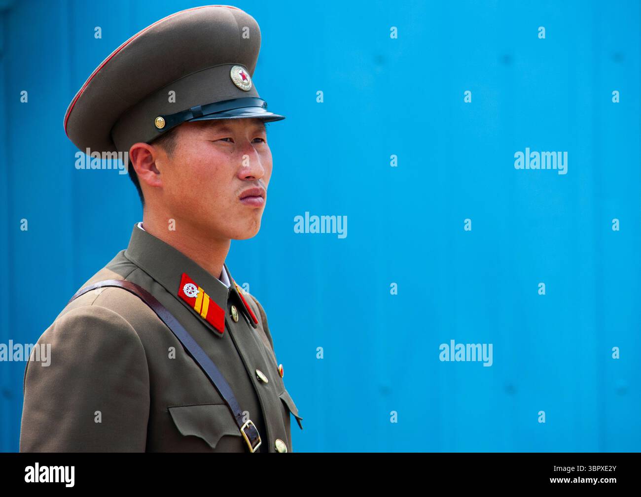 North Korean soldier standing on the demarcation line in the DMZ, North ...
