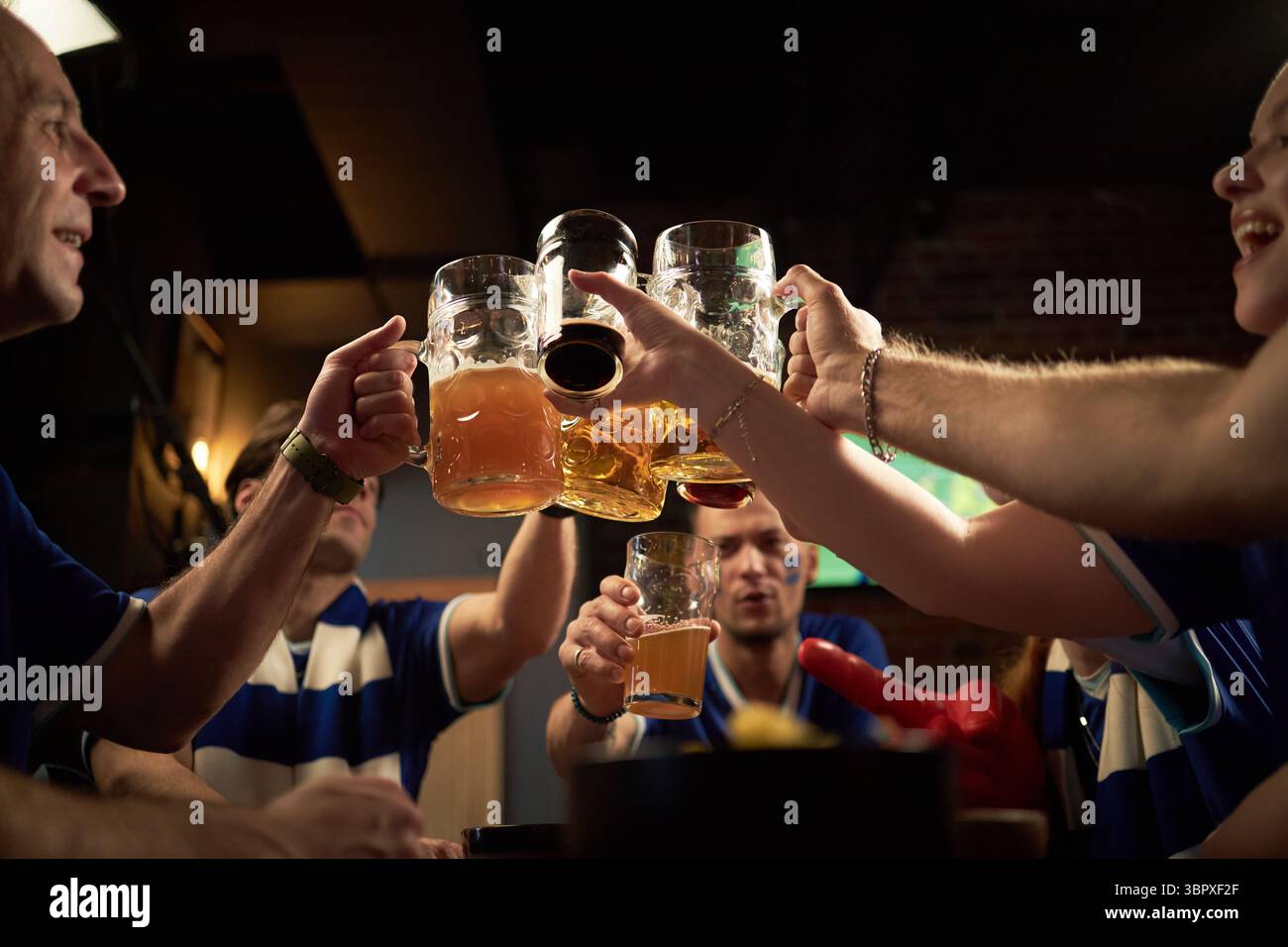 Soccer fans wearing jerseys hi-res stock photography and images - Alamy