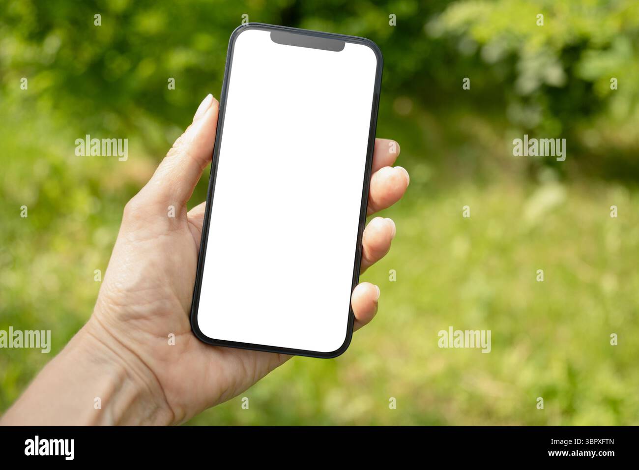 Womans hands holding smartphone outdoors hi-res stock photography and ...