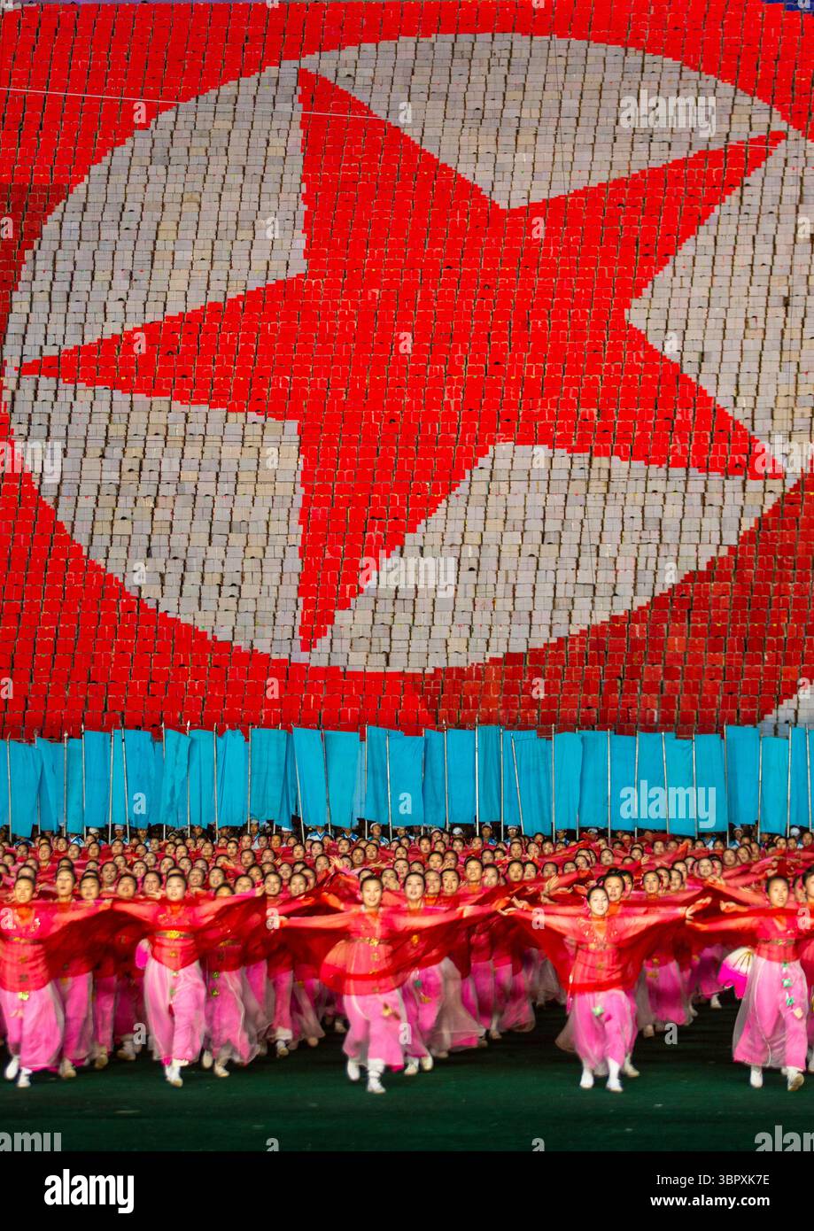 Women dancing in front of giant north korean flag during the Arirang ...