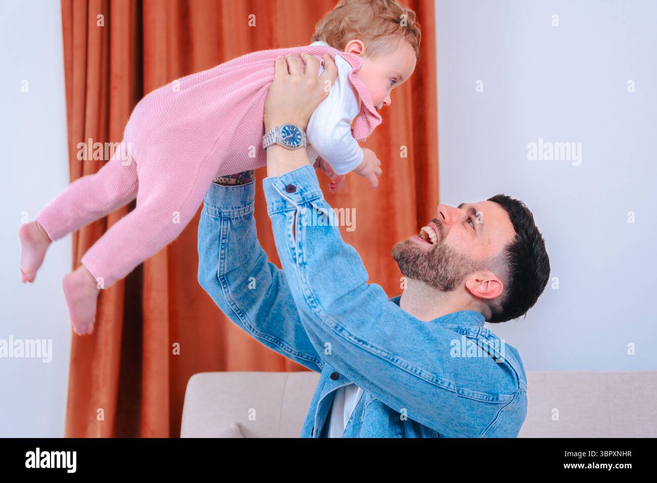 Joyful father lifts daughter in hi-res stock photography and images - Alamy