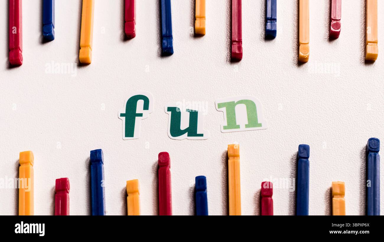 Colorful sticker word 'Fun' surrounded by vibrant plastic sticks on ...