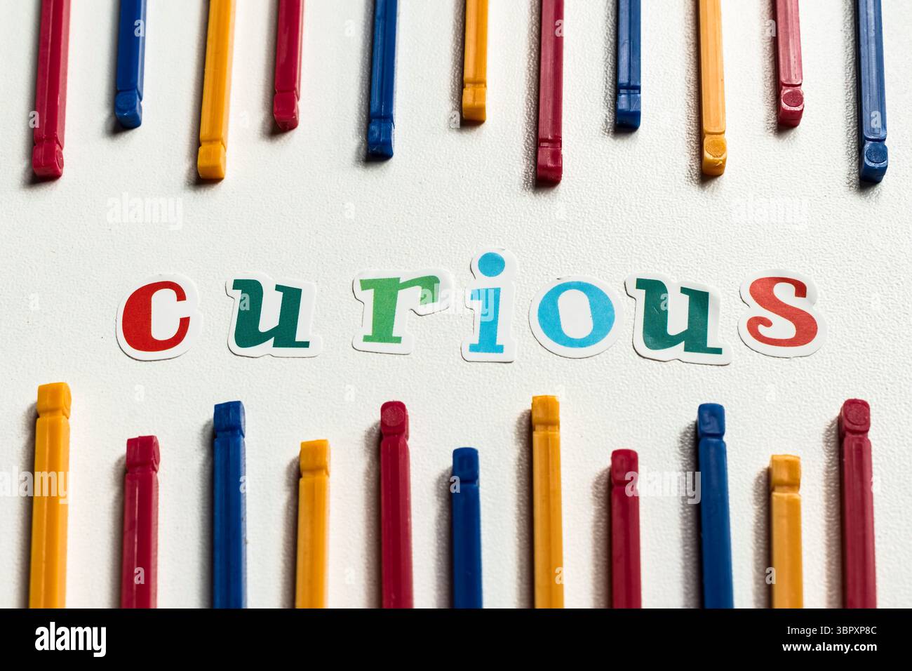 ''CURIOUS' word with colorful plastic sticks, isolated on white ...