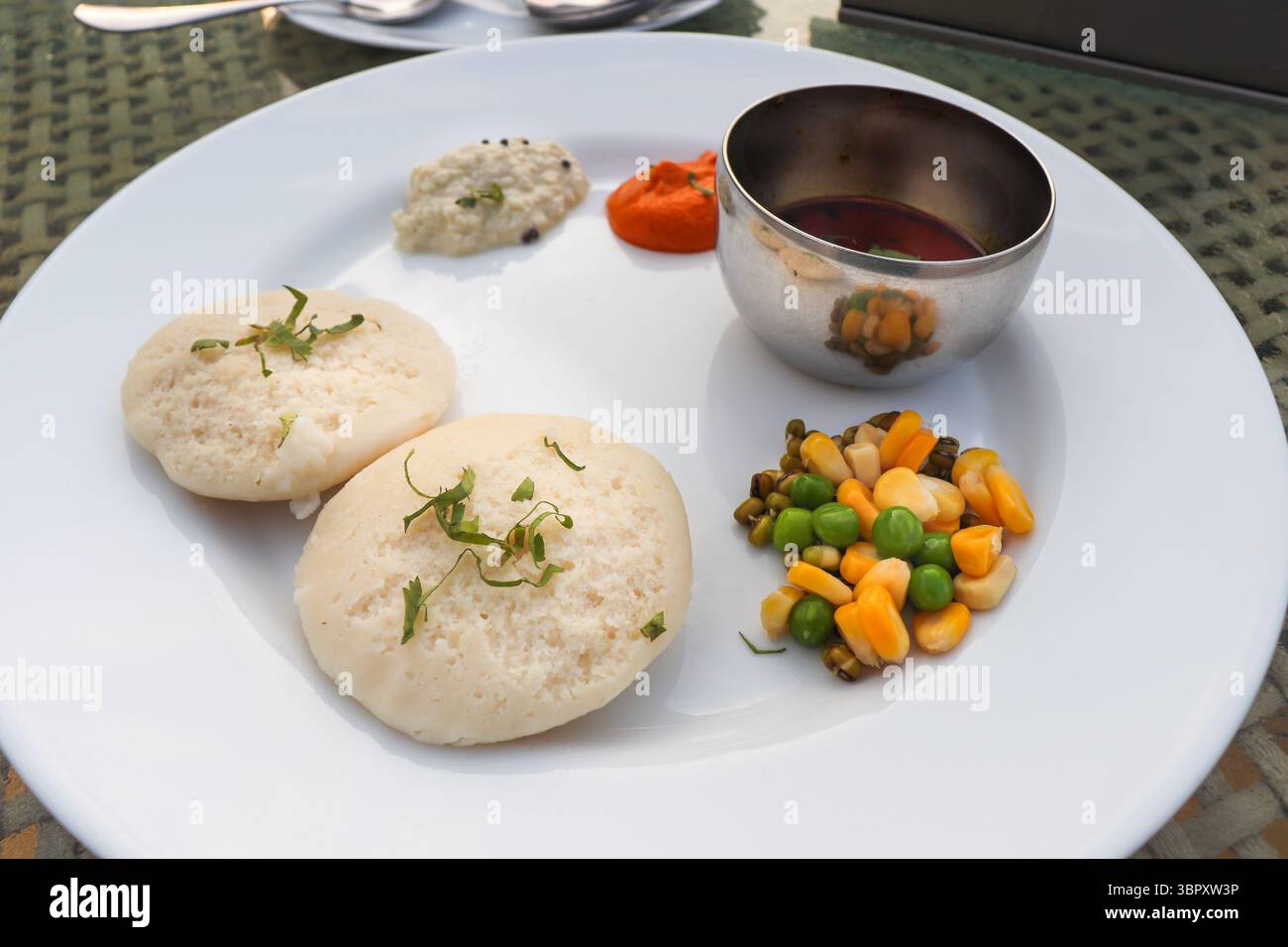 Classic South Indian breakfast. soft idlis served with coconut chutney ...