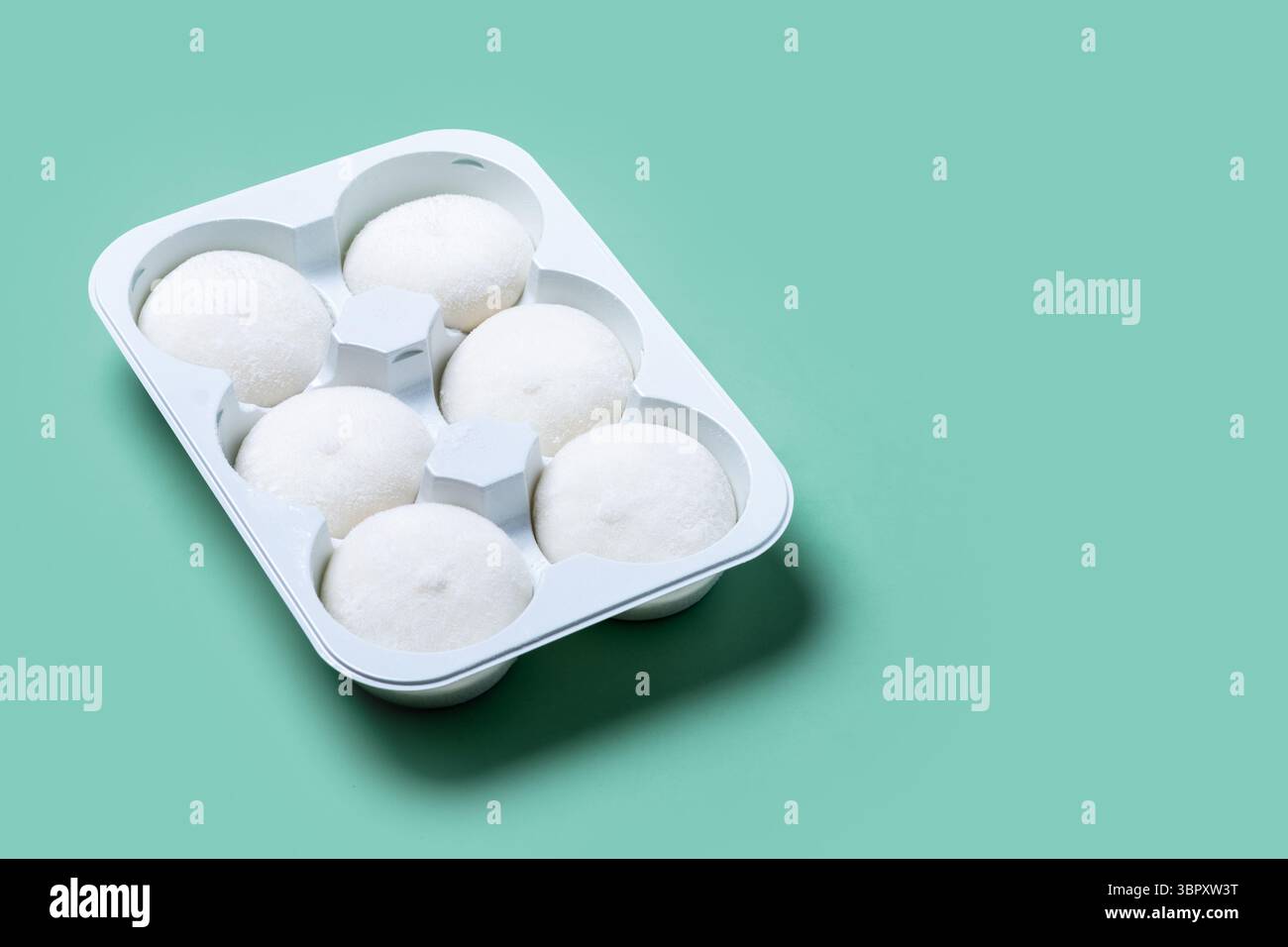 Japanese Mango ice cream mochi on green background Stock Photo - Alamy