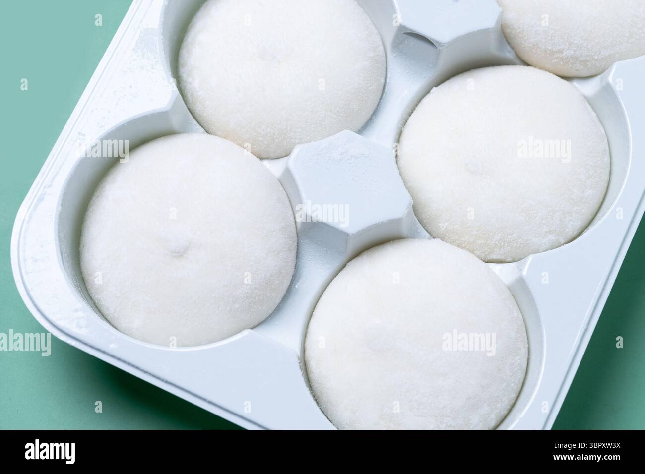 Japanese Mango ice cream mochi on green background Stock Photo - Alamy