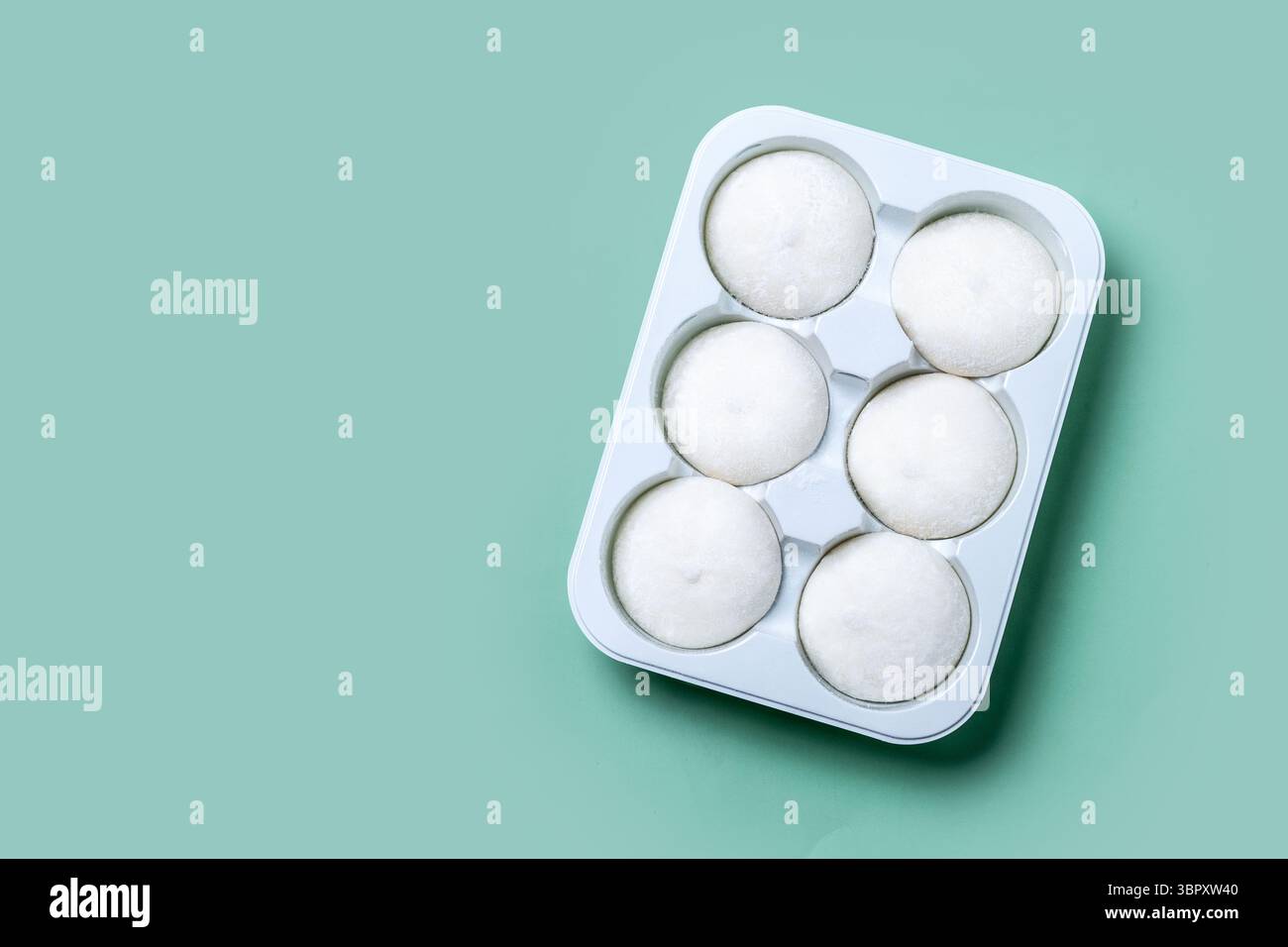 Japanese Mango ice cream mochi on green background Stock Photo - Alamy