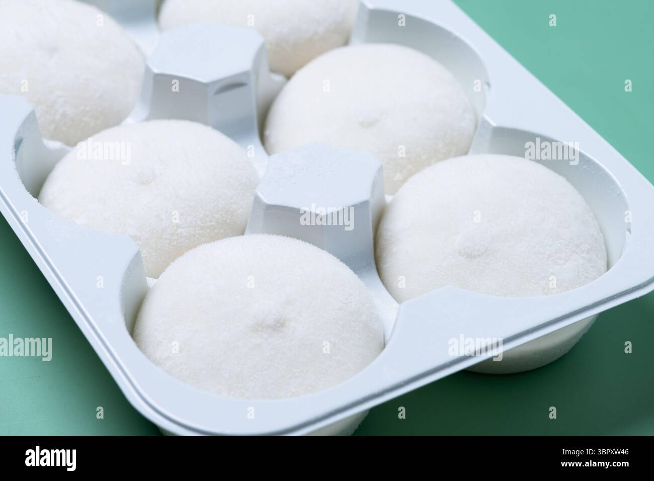 Japanese Mango ice cream mochi on green background Stock Photo - Alamy