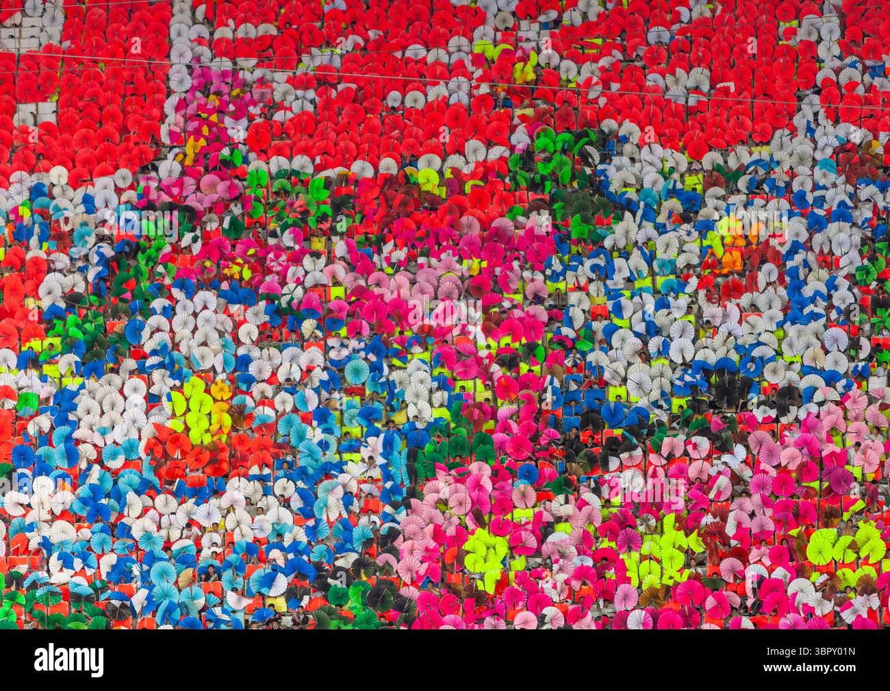 Children holding up boards during Arirang to create flowers, DGC, Pyongyang, North Korea Stock ...