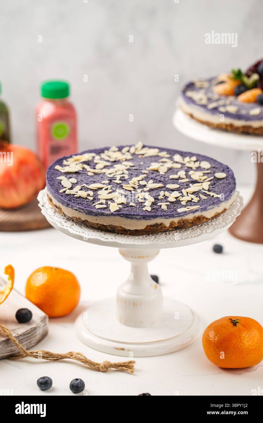 Blueberry cake with almond flakes on stand Stock Photo - Alamy