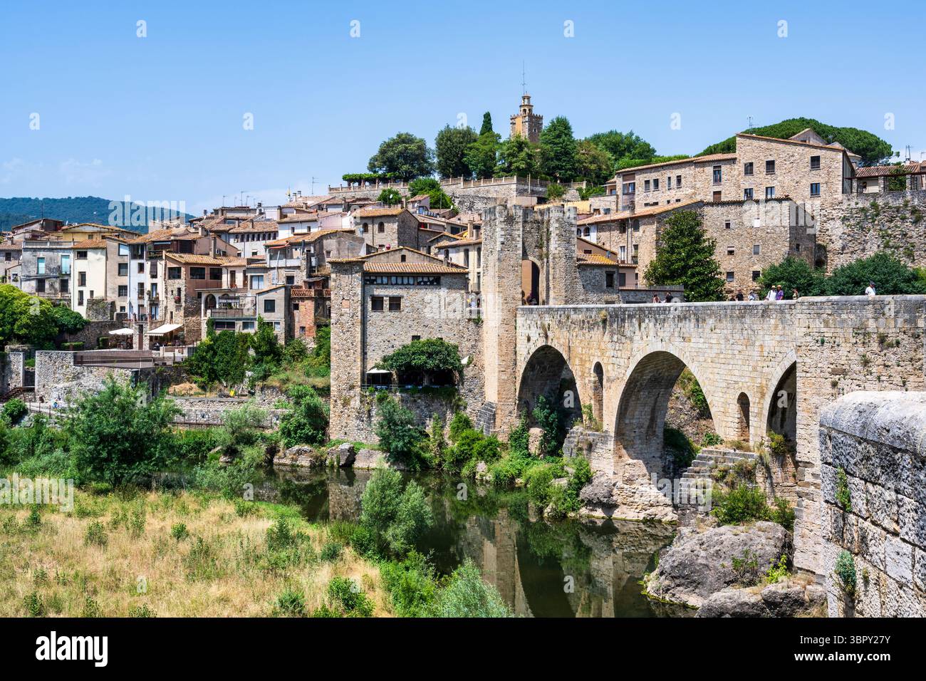 Medieval town and 12th-century Romanesque bridge over the Fluvia river ...