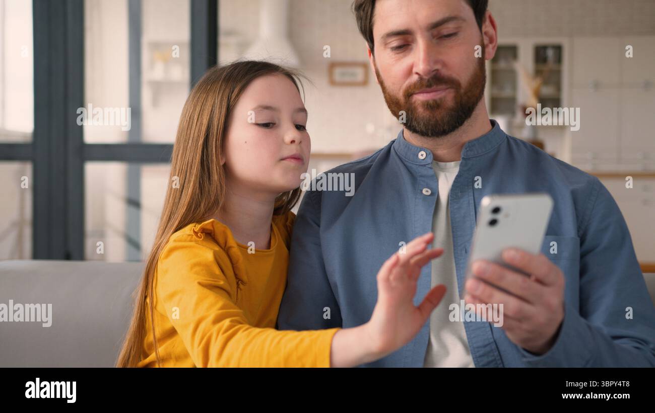 Glad Caucasian child little girl talking father male dad man using ...