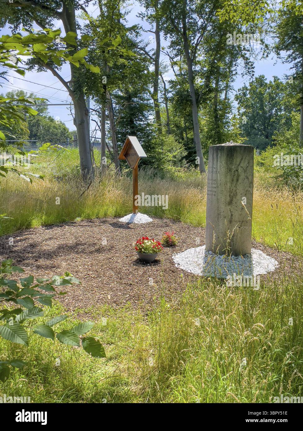 Free-standing stone column on the right Monument with inscription in ...