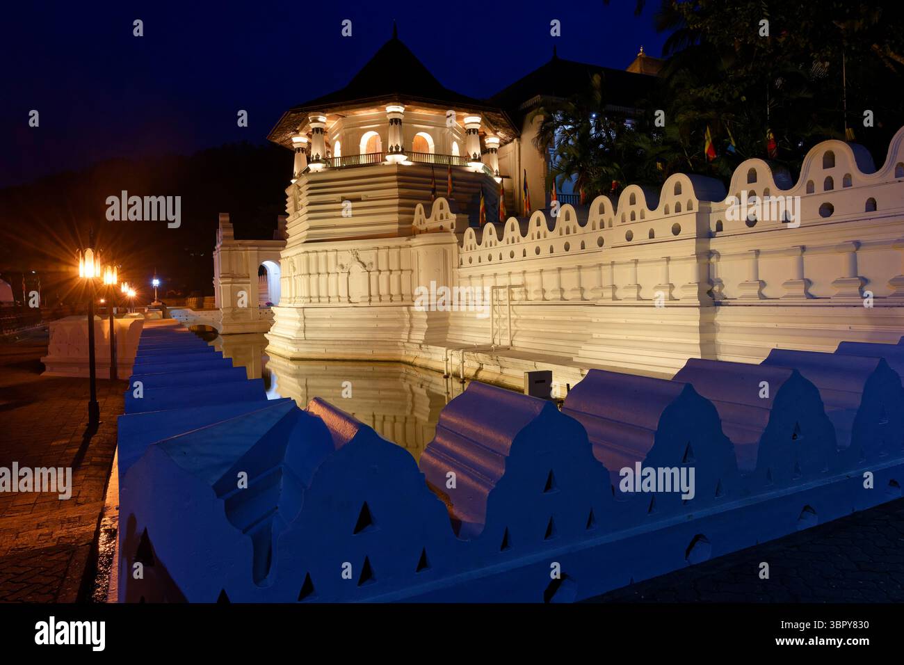 Temple of the sacred Tooth Relic or Sri Dalada Maligawa, Octagonal tower at sunrise, Kandy, Sri ...