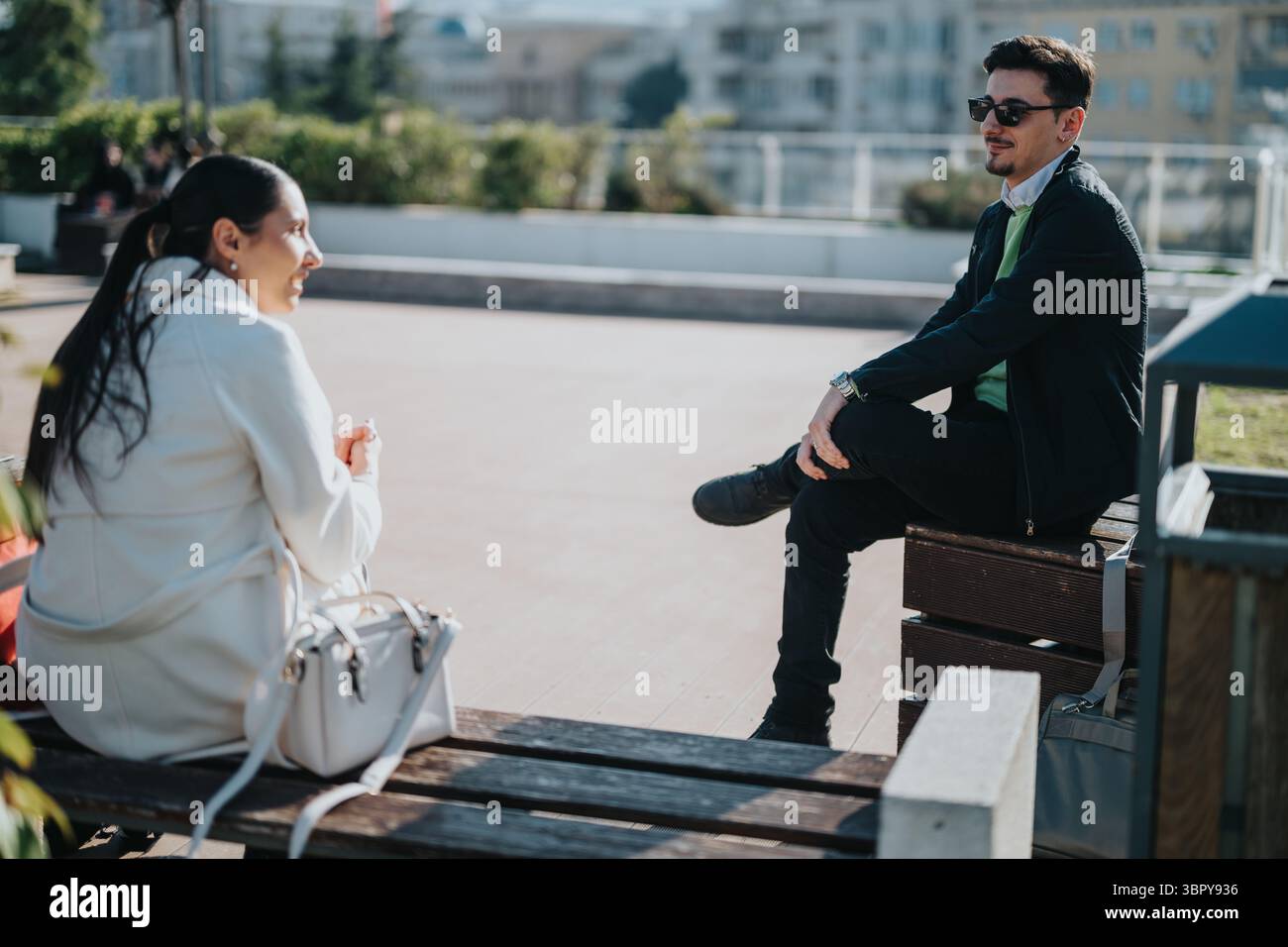 Group people sitting on benches hi-res stock photography and images - Alamy