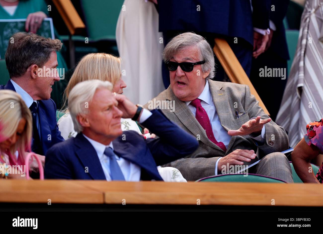 Sir Stephen Fry speaking with Rob Brydon (left) in the Royal Box on day ...