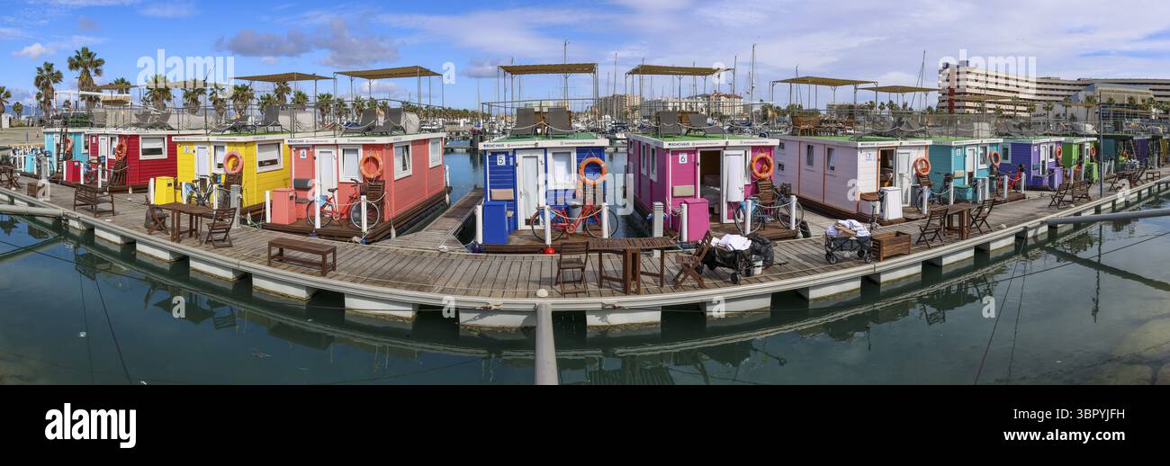 Panoramic photo of the colourful houseboats in the harbour of Puerto ...