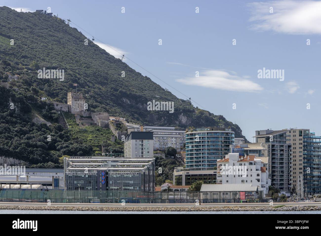 Tall buildings of the city and in the background the Moorish Castle and ...