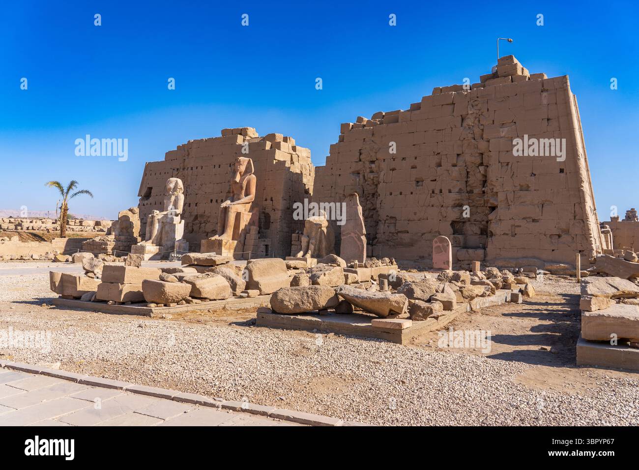 Giant statues at the Third Pylon depict pharaohs, Thutmose III ...