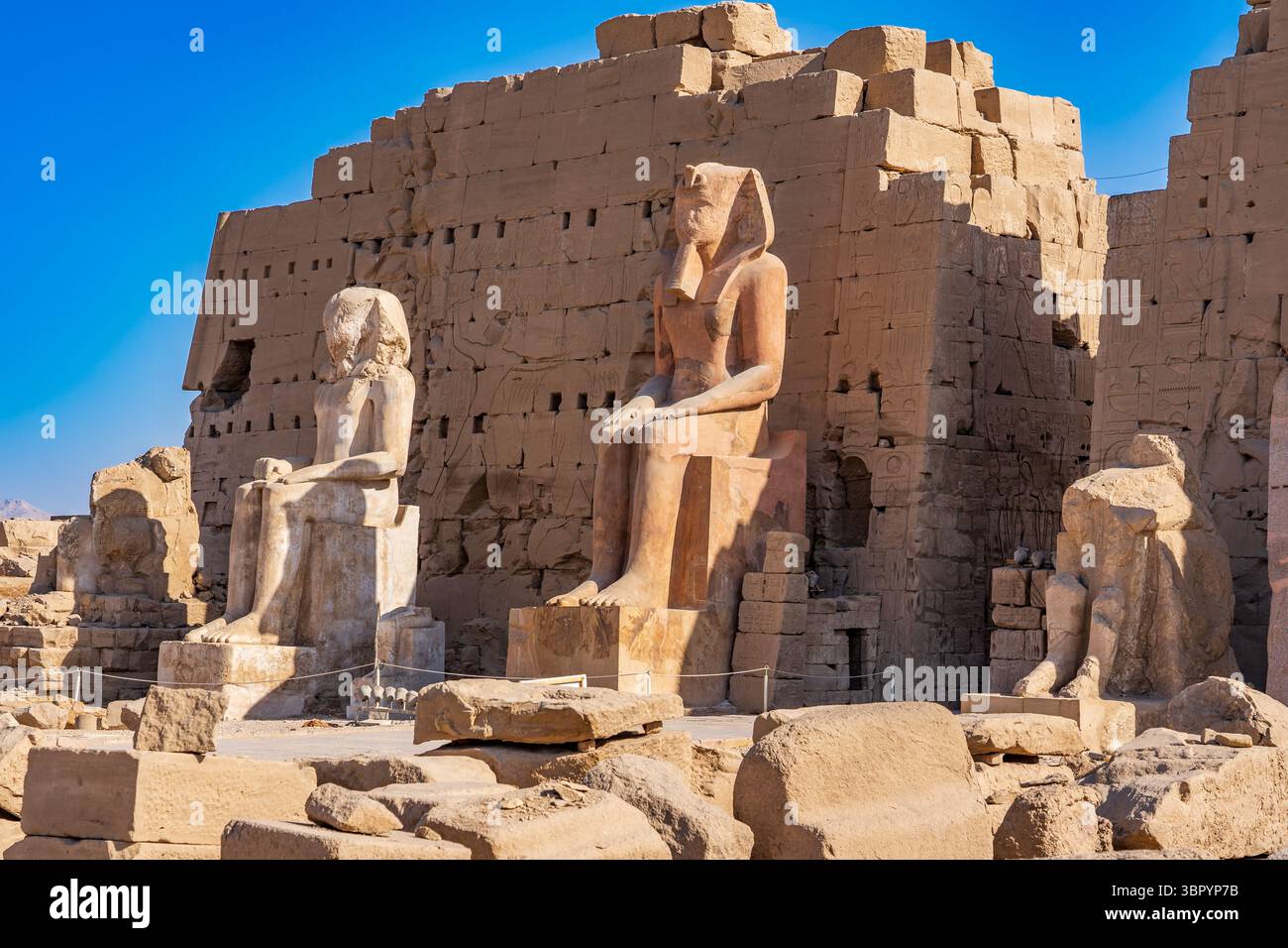 Giant statues at the Third Pylon depict pharaohs, Thutmose III ...