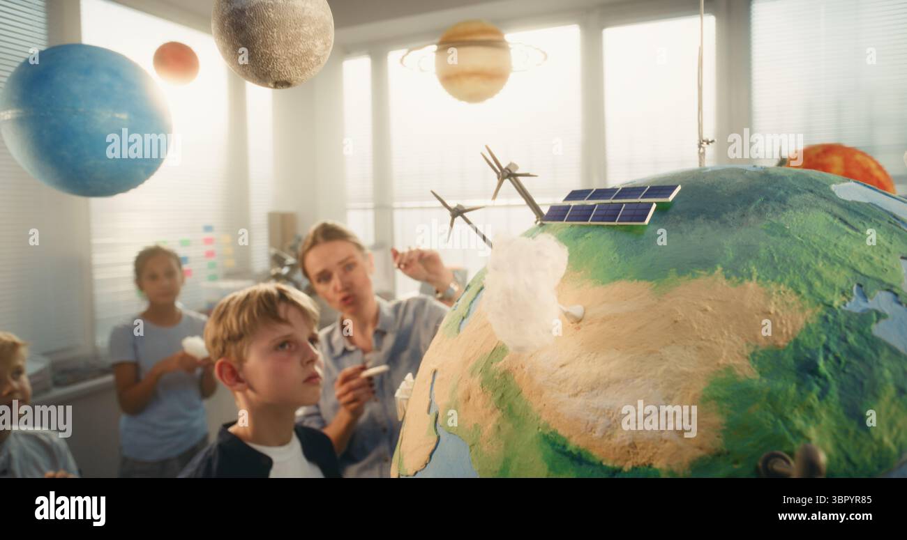 Environmental Science Lesson: Female Teacher Educating Renewable Energy ...