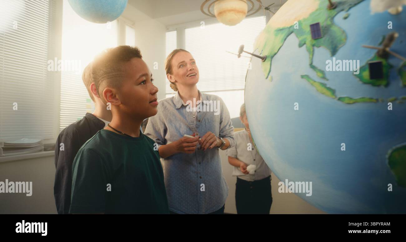 STEM Class: Female Teacher Explaining Renewable Energy Sources to Team ...