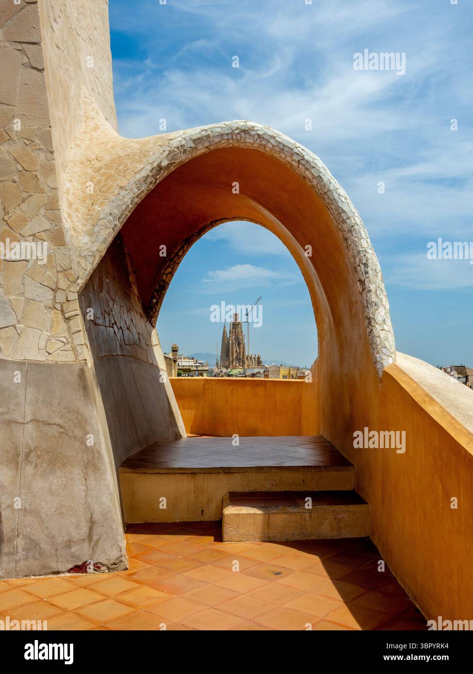 La Sagrada Familia basilica is perfectly framed by a stone arch on the ...
