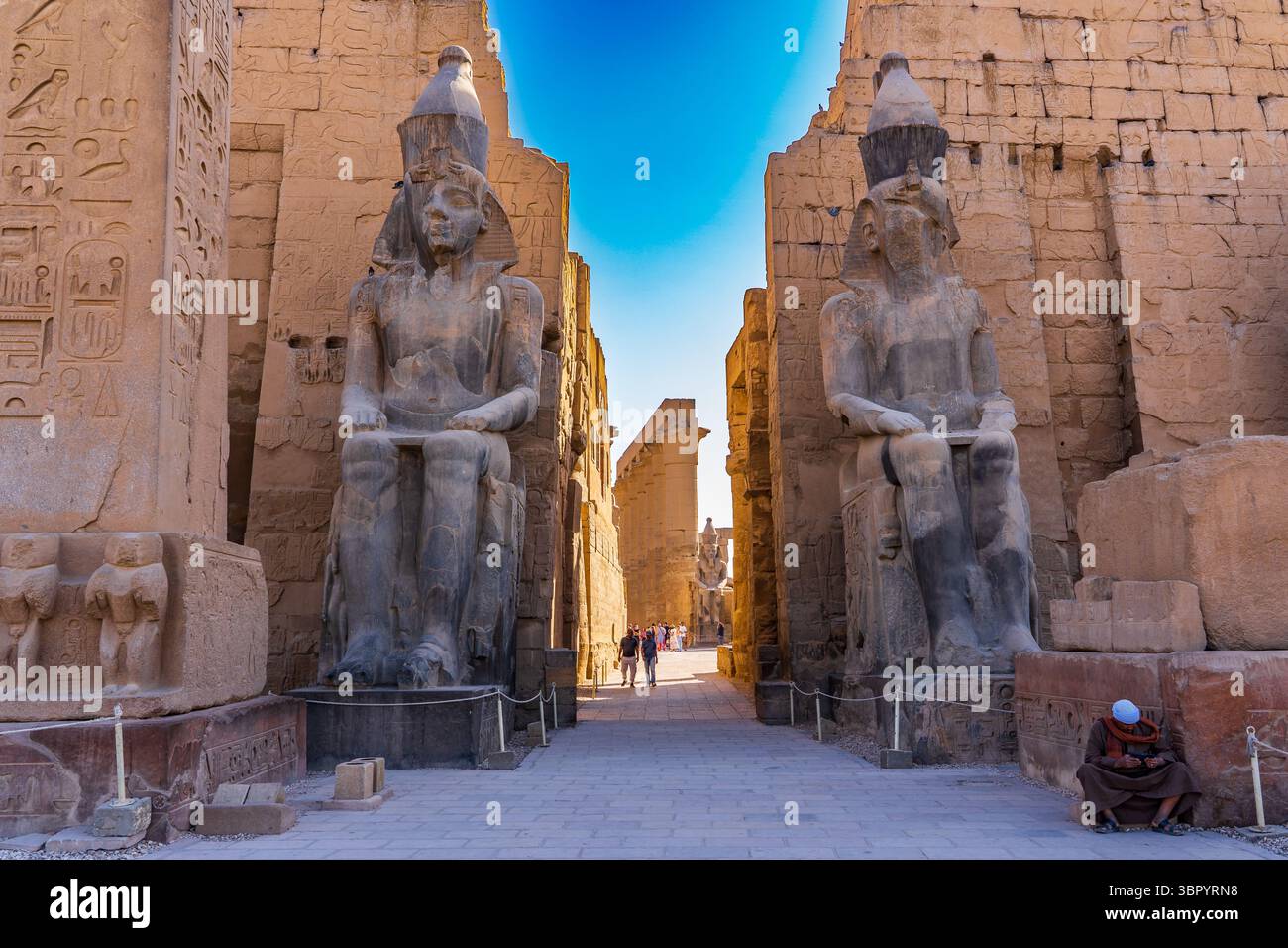 Entrance to Luxor Temple with colossal statues of Ramses II Stock Photo ...