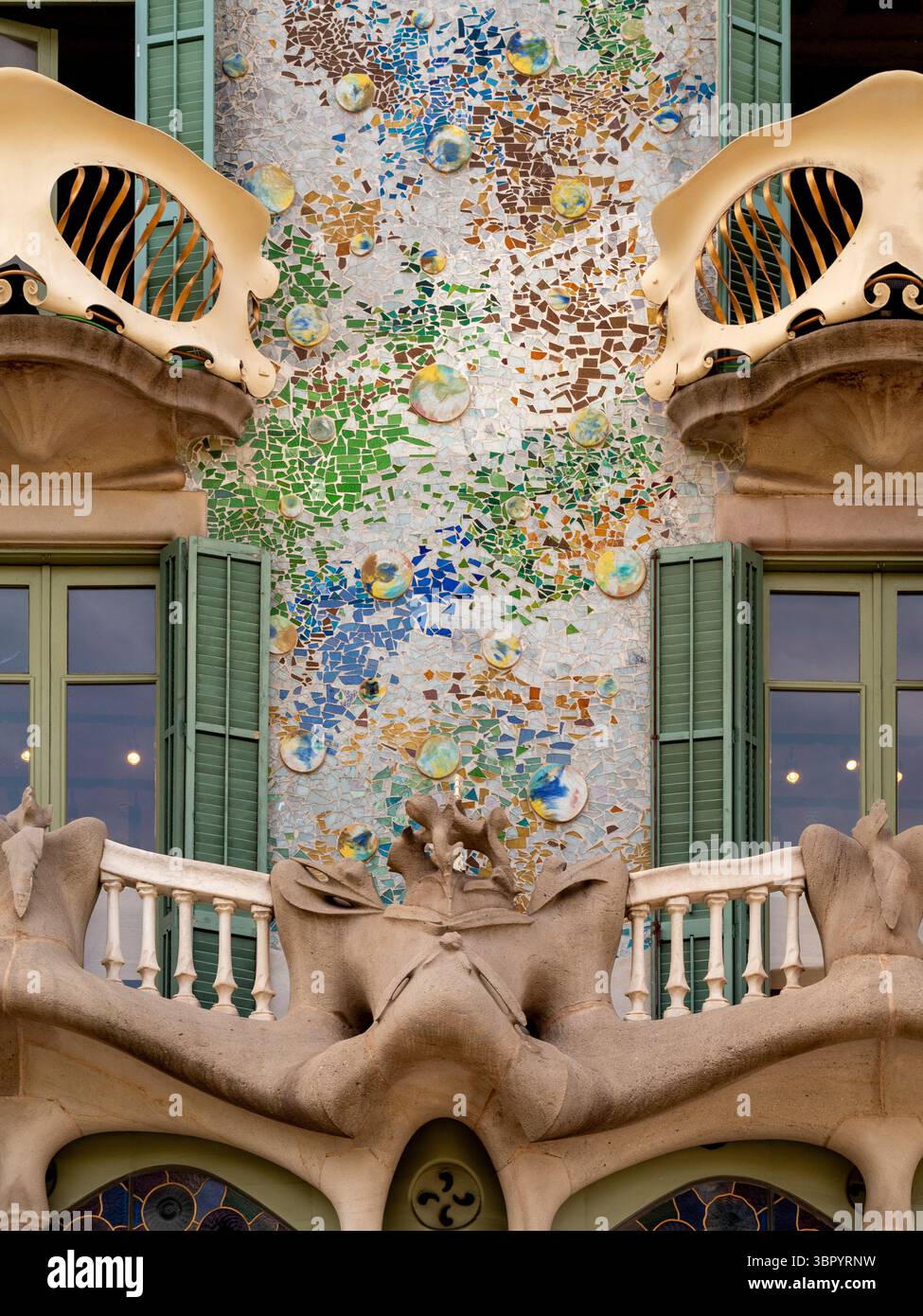 Detail of the unique skull-like balconies and colourful 'trencadís ...