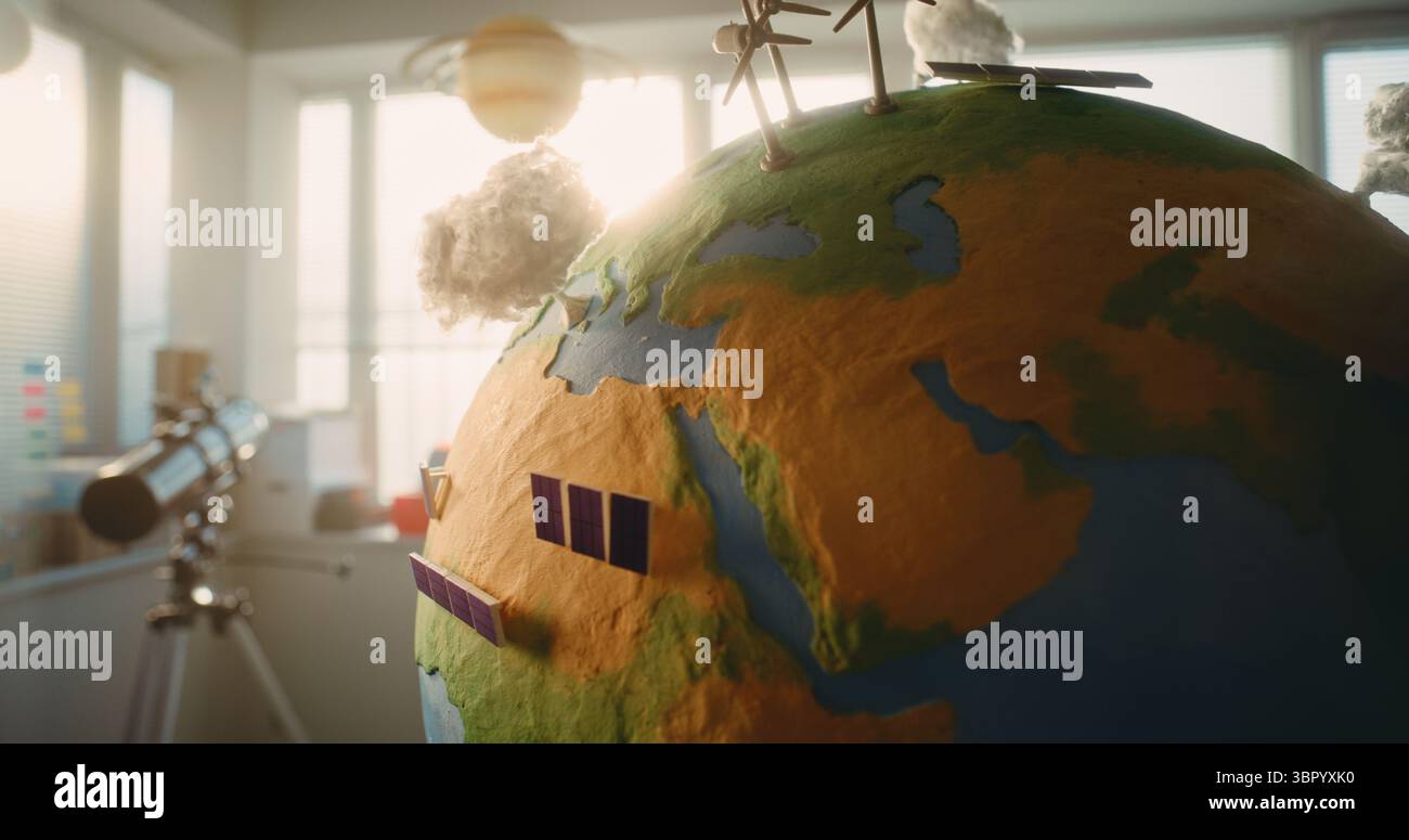 Modern STEM Classroom: Close Up of Rotating Earth Model with Miniature ...