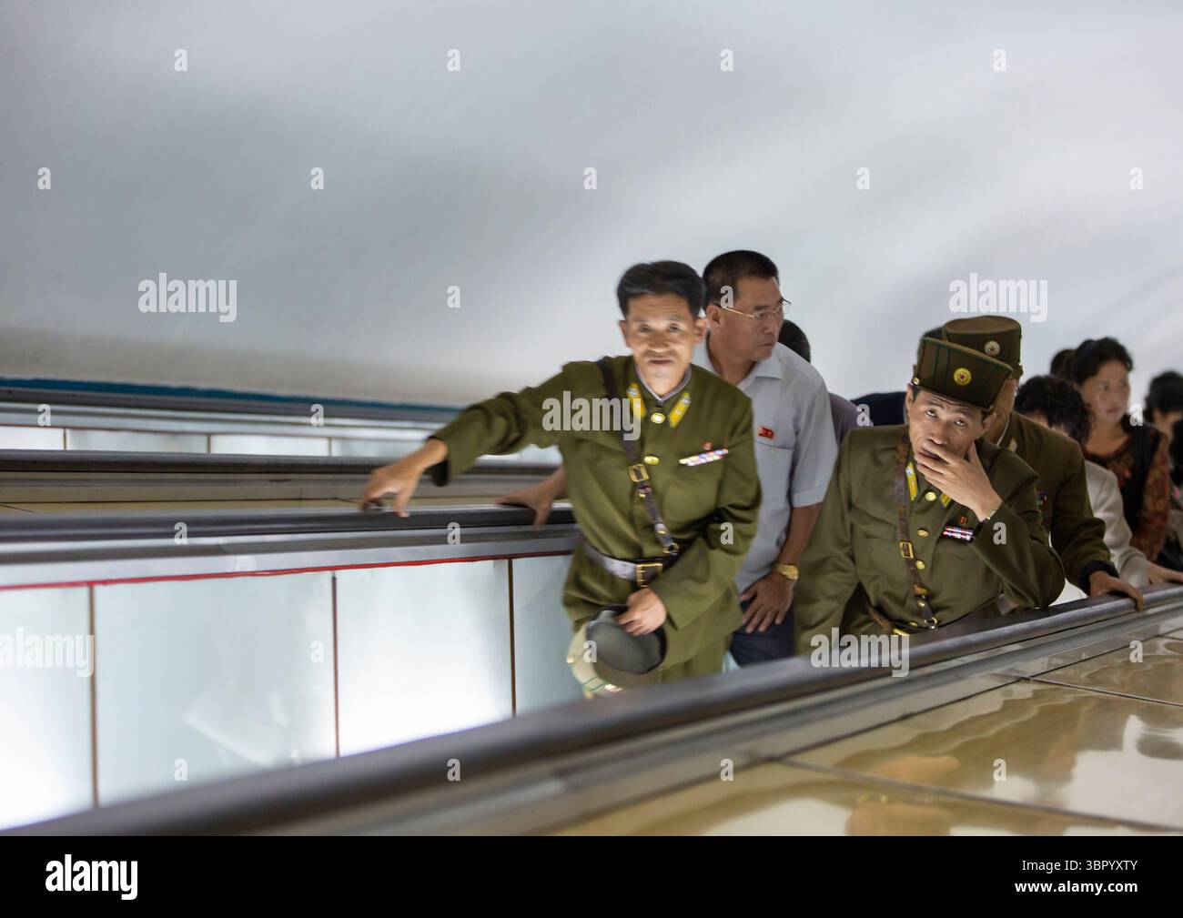 North Korean soldiers using escalator leading to the subway station ...