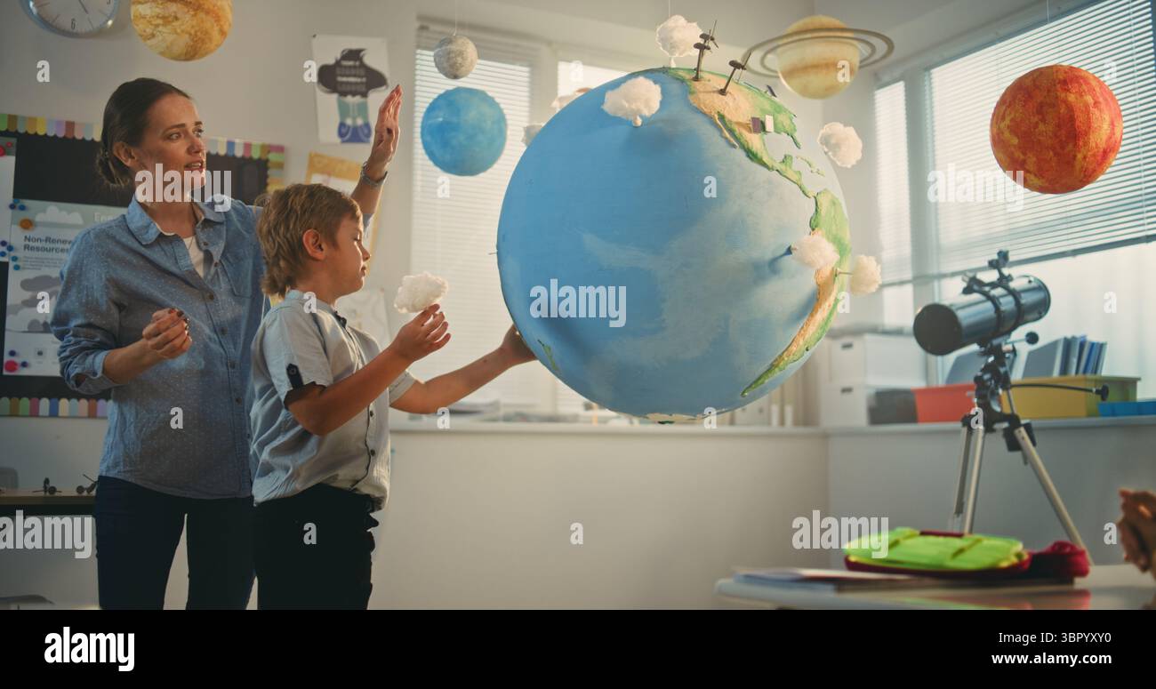 Female Teacher Educating Smart Kids During Science Lesson in Modern ...