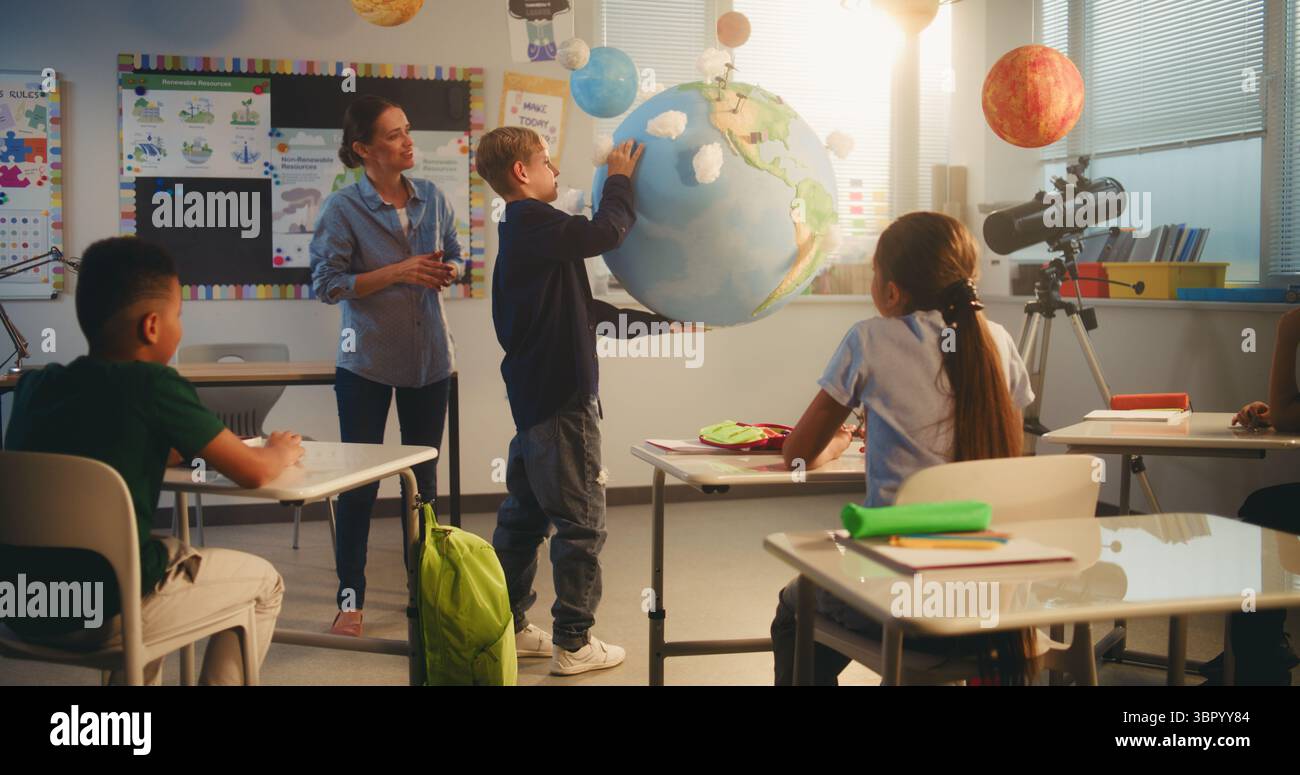 Primary School Boy Presenting Green Energy Sources in Front of Class ...