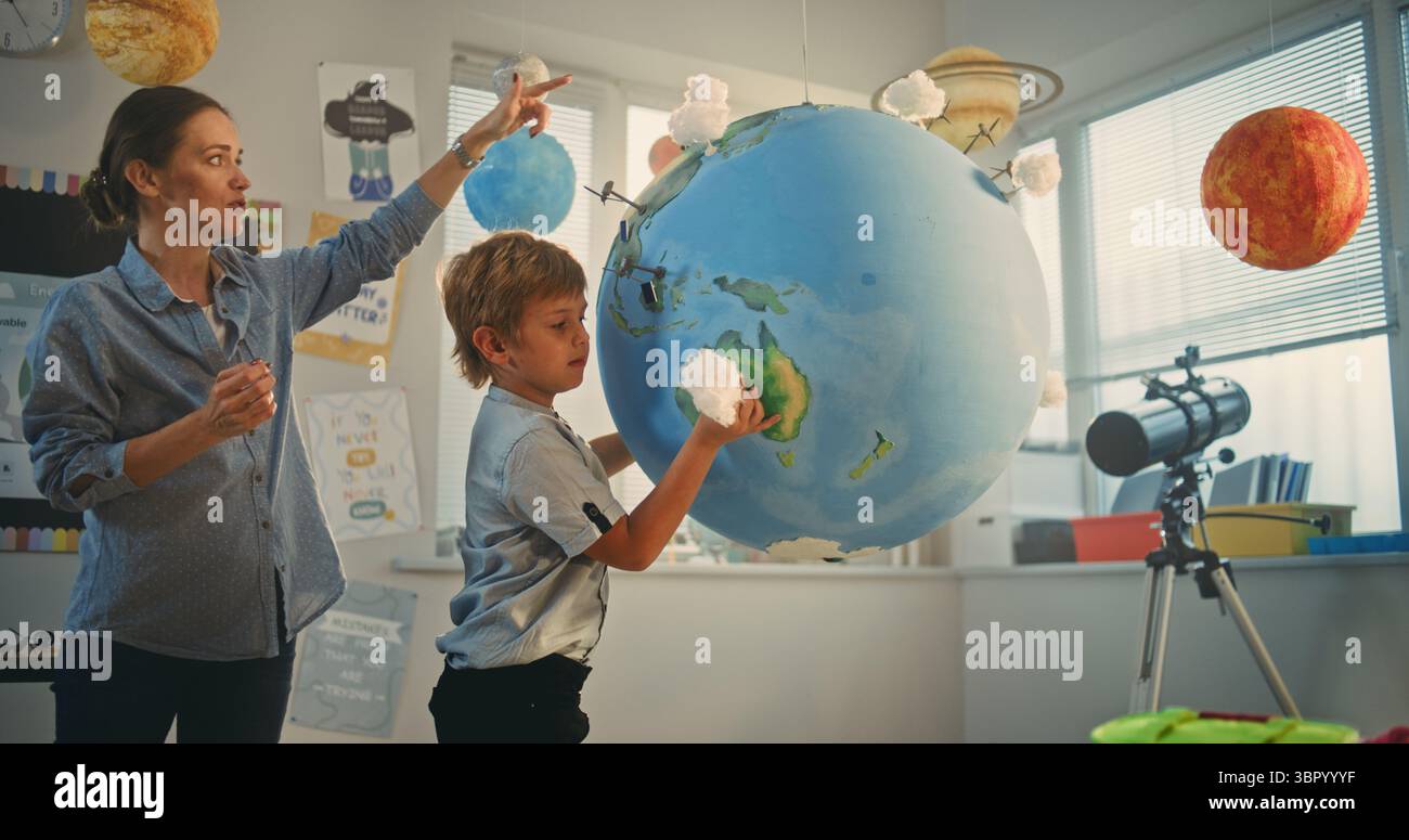 Female Teacher Educating Smart Kids During Science Lesson in Modern ...