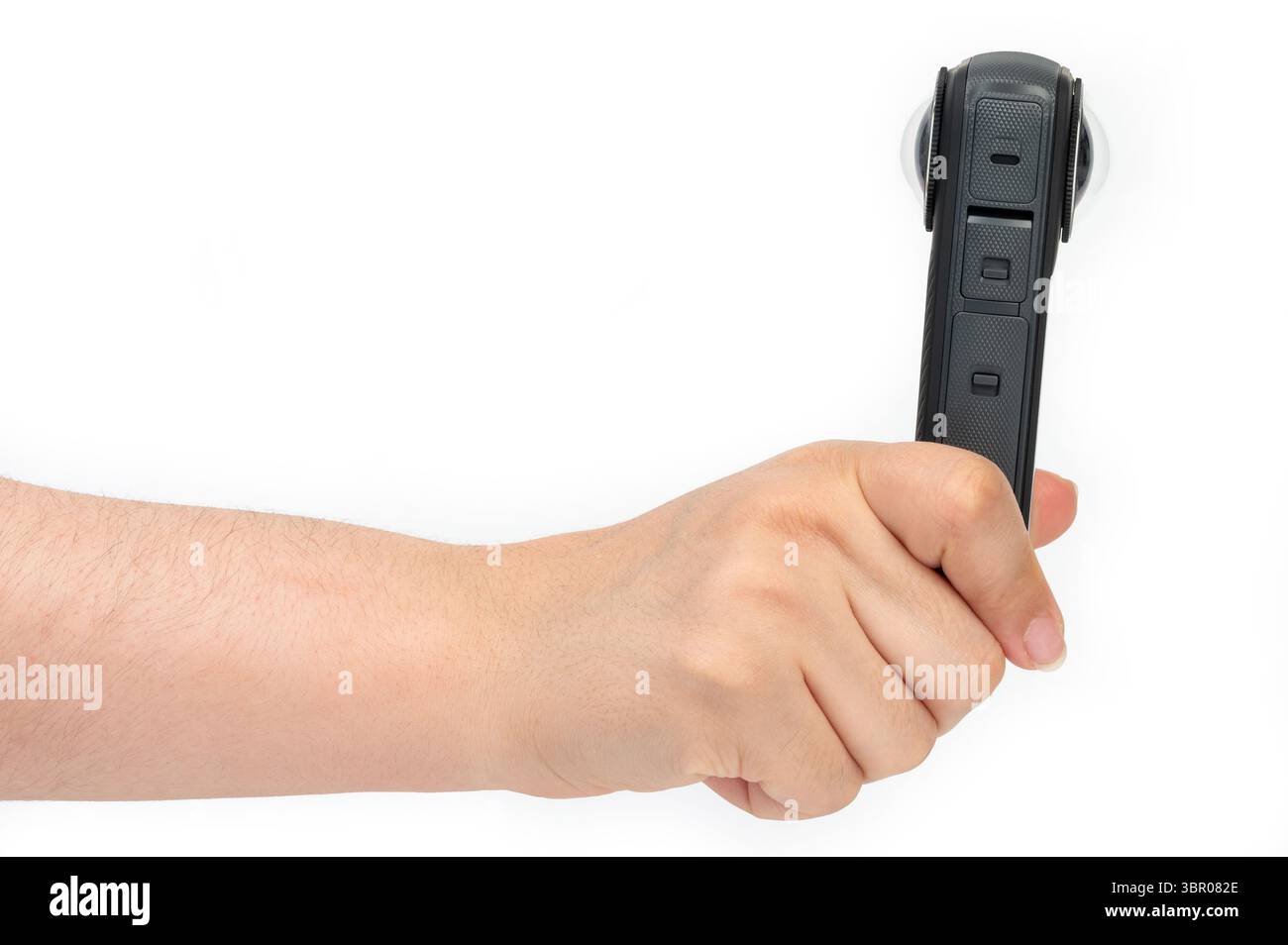 Close up of 360 camera in hand side view isolated on studio background ...