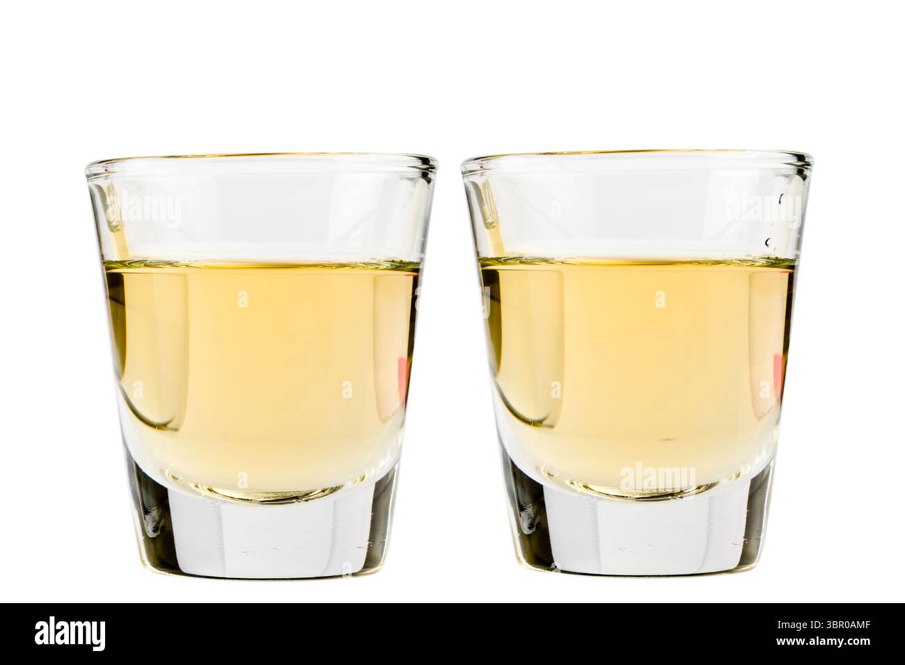 tequila in two shot glasses isolated on white background Stock Photo ...