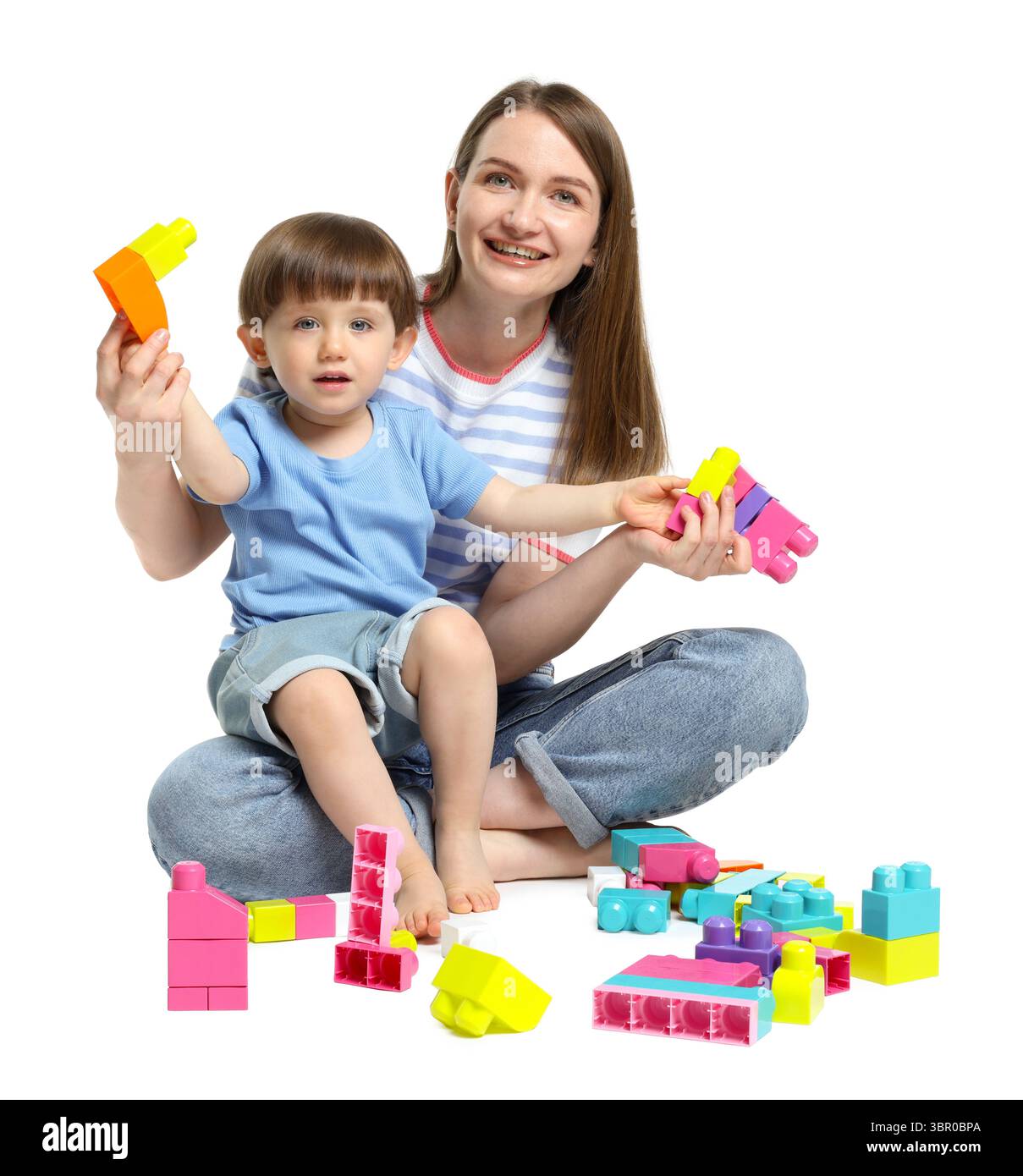 Mother and son playing with building bricks on white background Stock ...