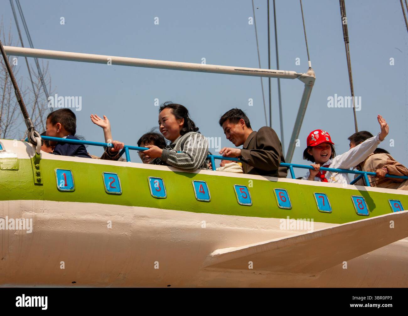 People having fun on a plane attraction in Taesongsan funfair, DGC ...