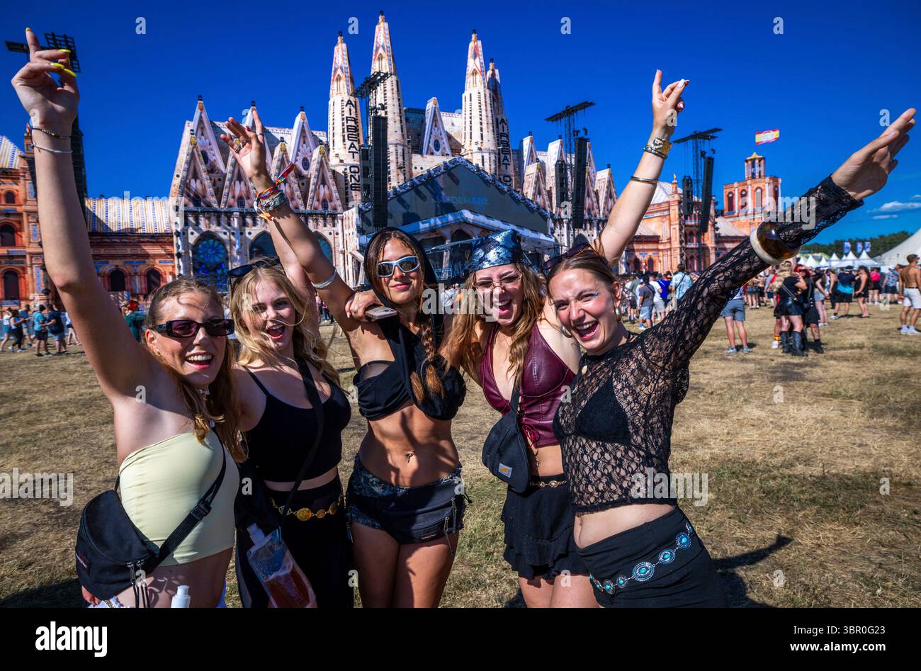 Festival-goer pose in front of the main stage of the Airbeat One ...