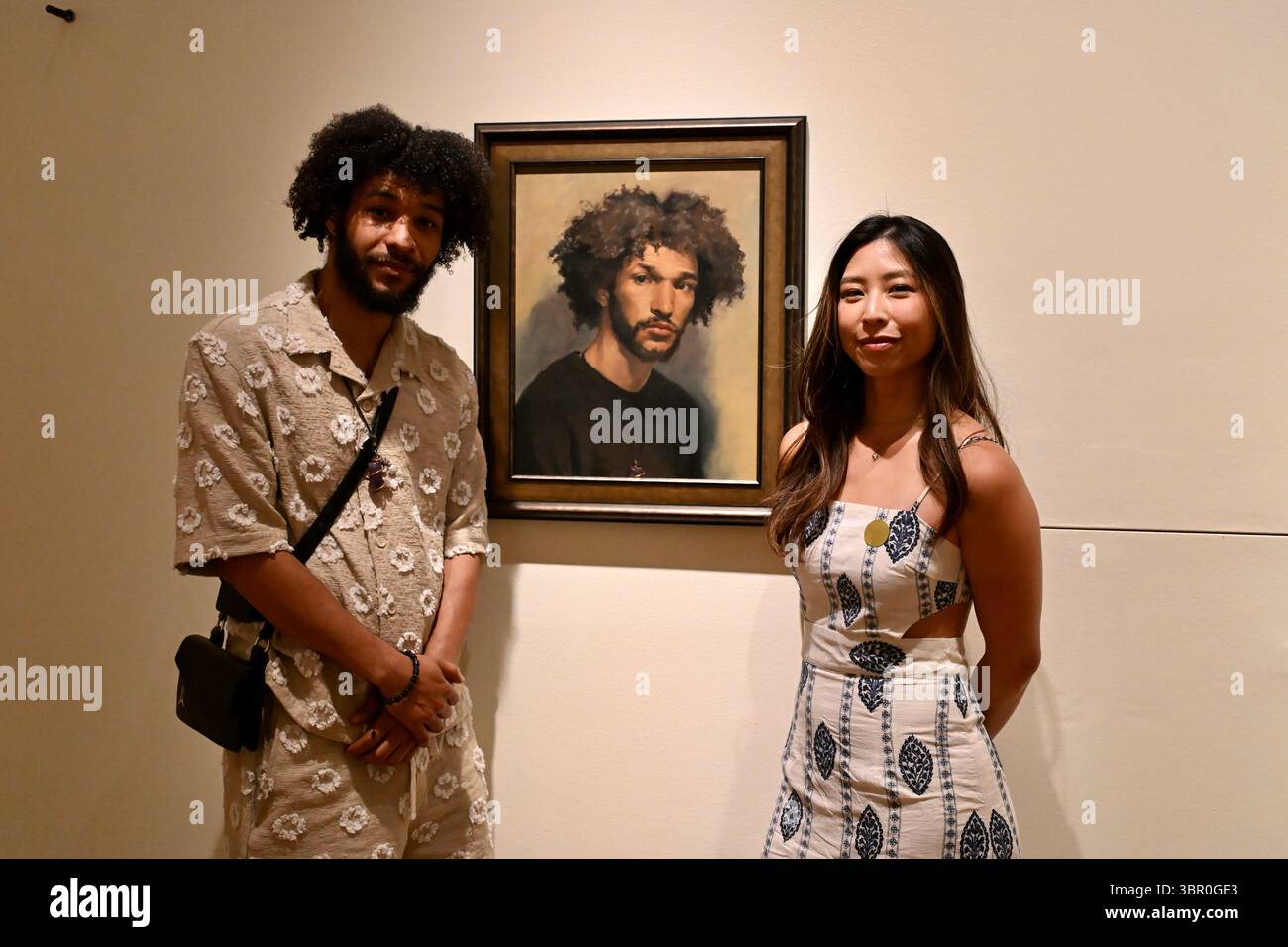 Artist Michelle Liu with her model and painting "Kofi" winner of the ...