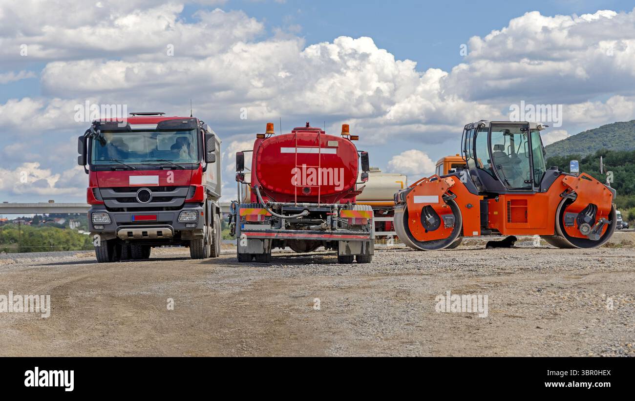 Dump Truck Water Tanker Road Roller Machine at Construction Site of New ...