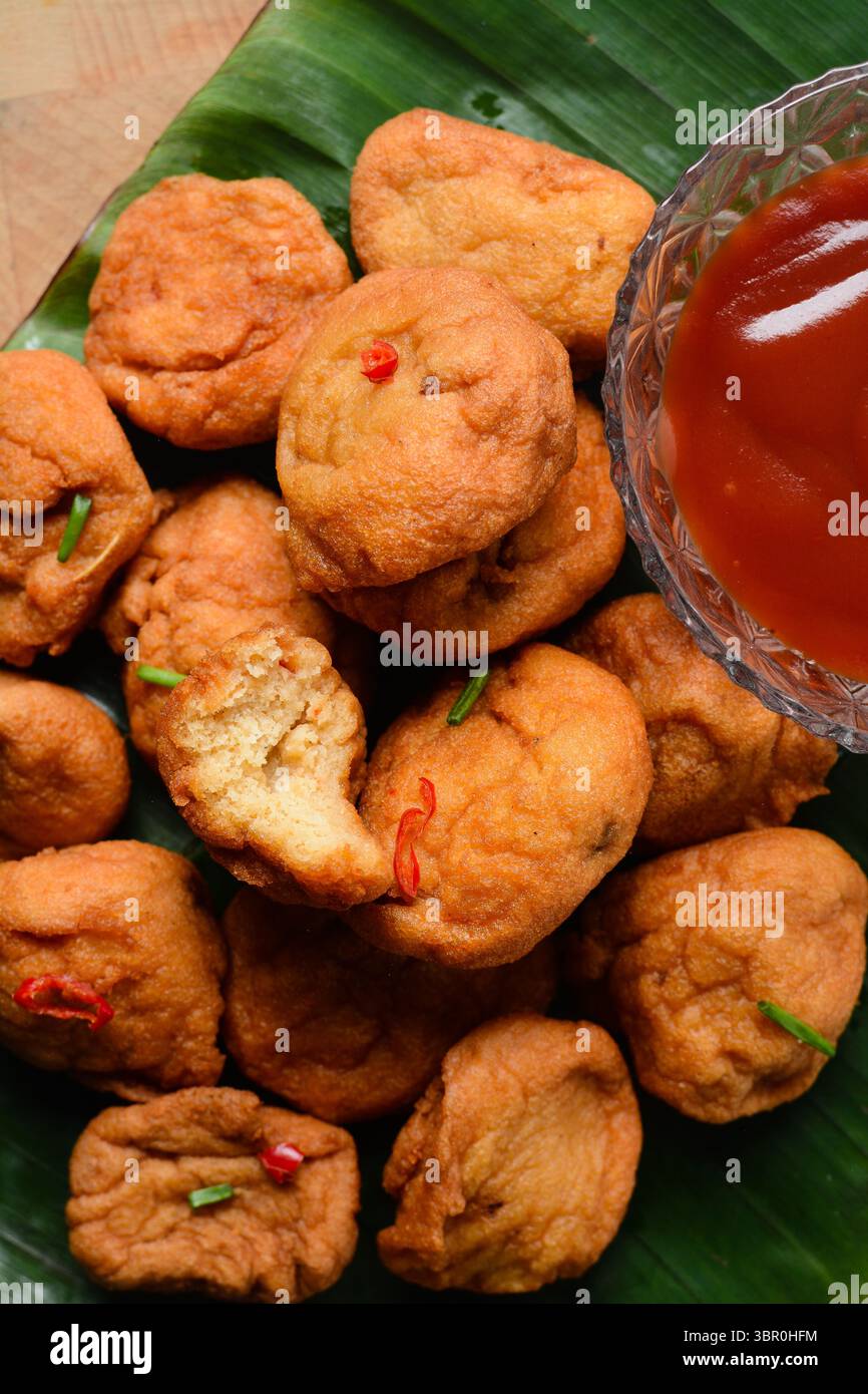 Overhead view of Akara and tomato sauce on plantain leaf, top view of ...