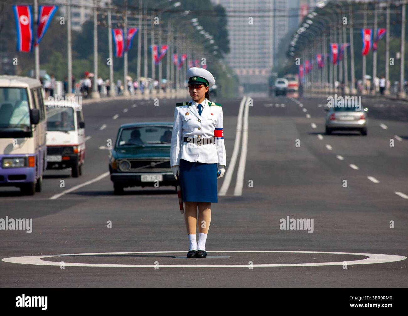 North Korean female traffic security officer in white uniform in the ...