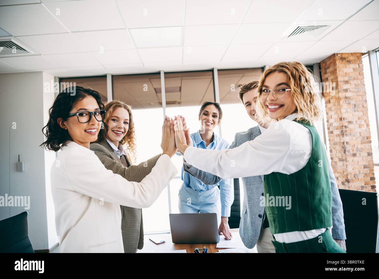 Diverse business team collaborates successfully, building professional ...