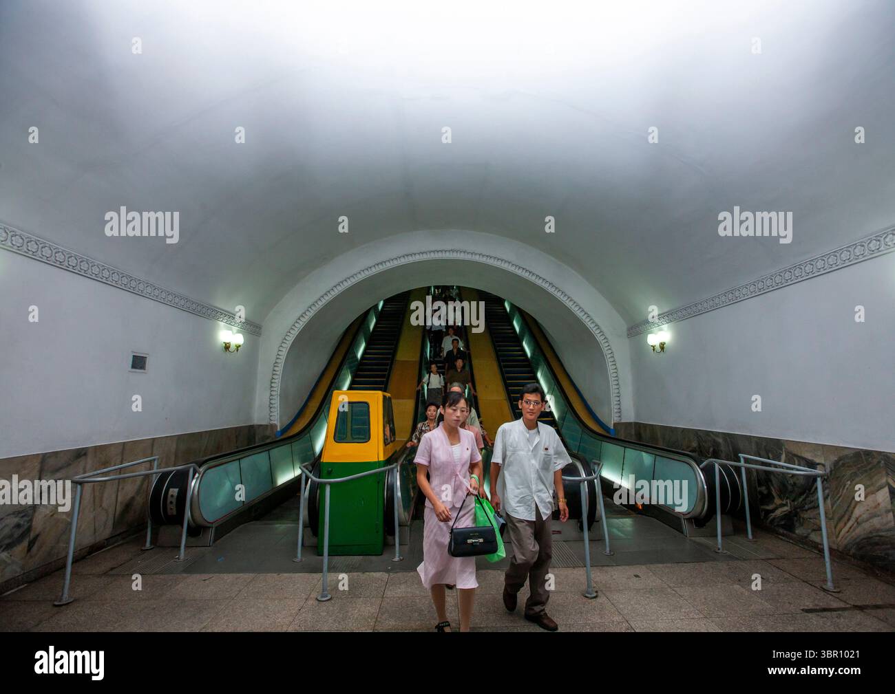 North Korean people using escalator leading to the subway station, DGC ...